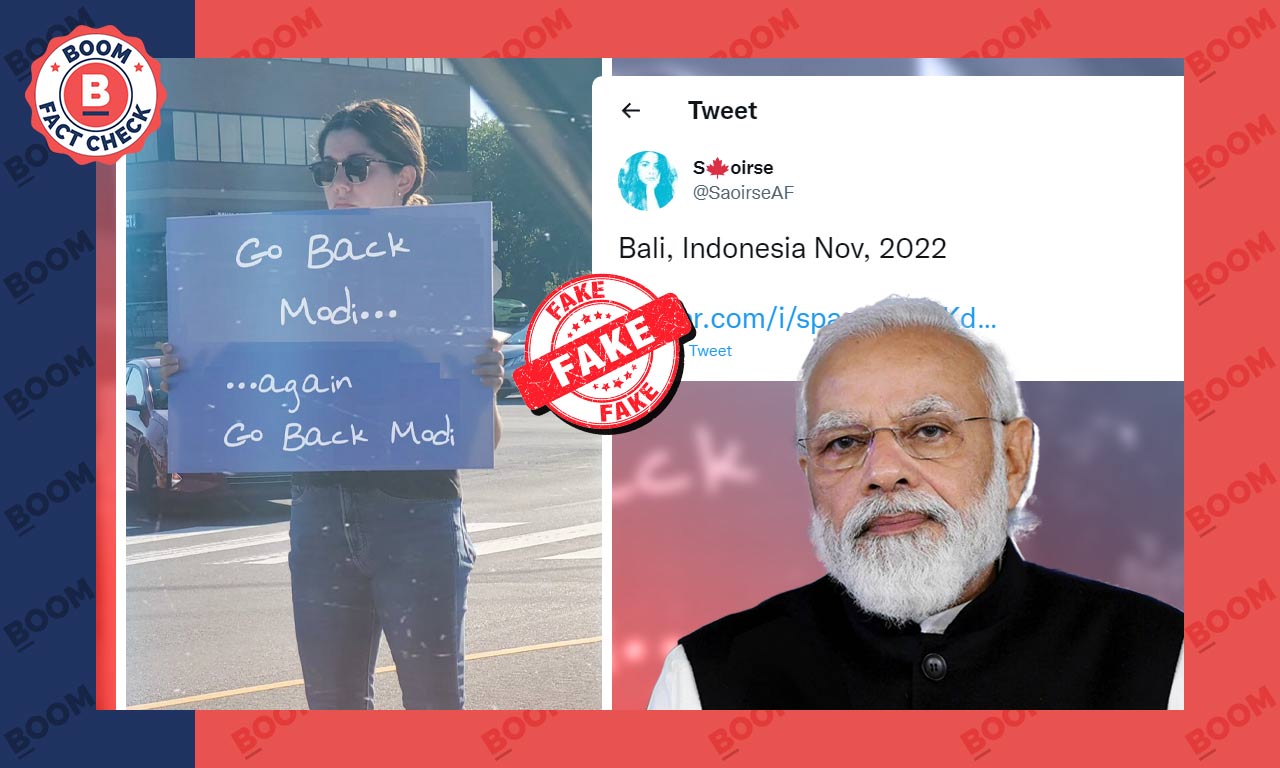 Viral Photo of Woman Holding 'Go Back Modi' Placard Is Morphed | BOOM